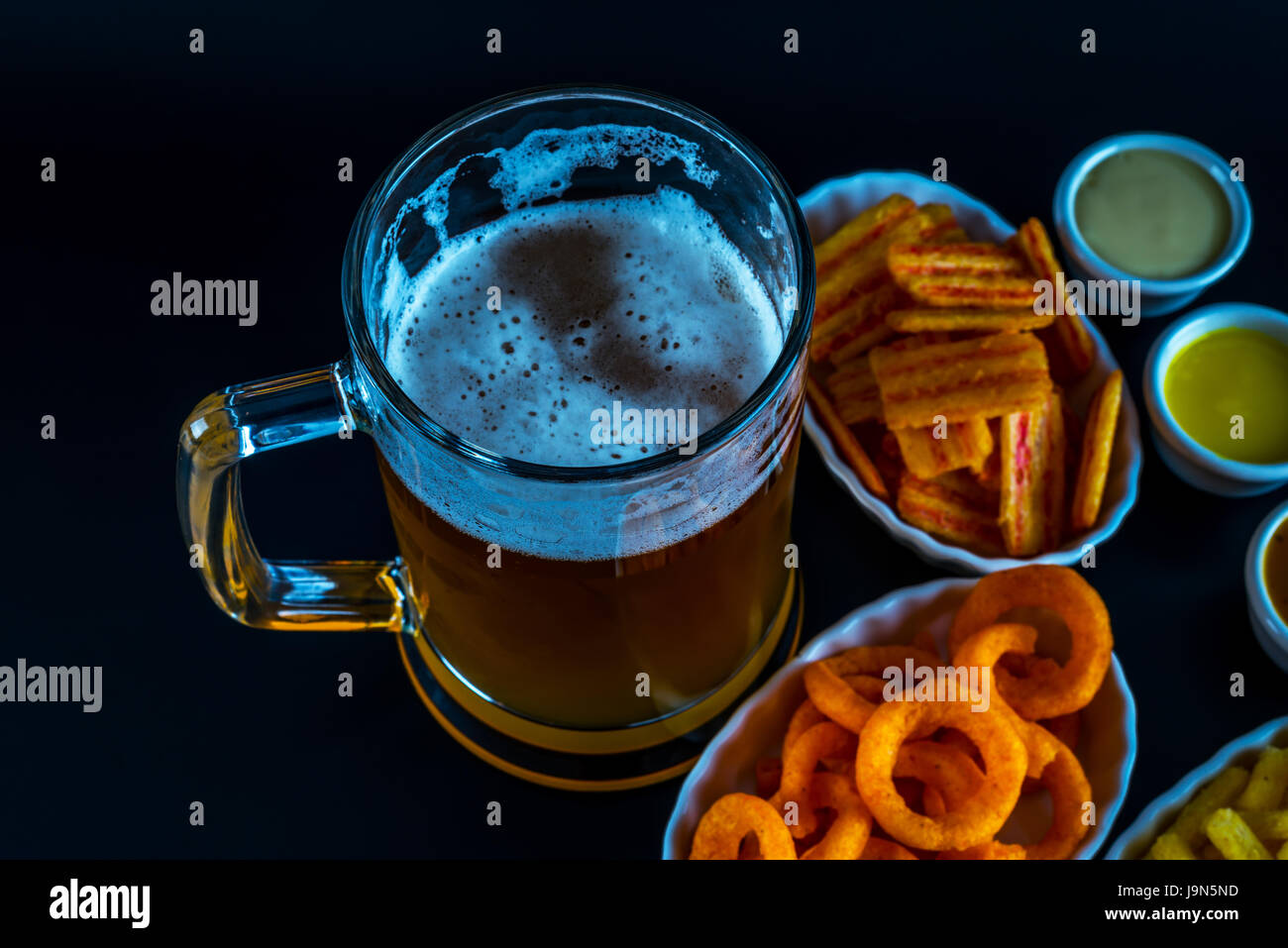 Set of snacks with dip and pint of beer, crunchy snacks, good food ...