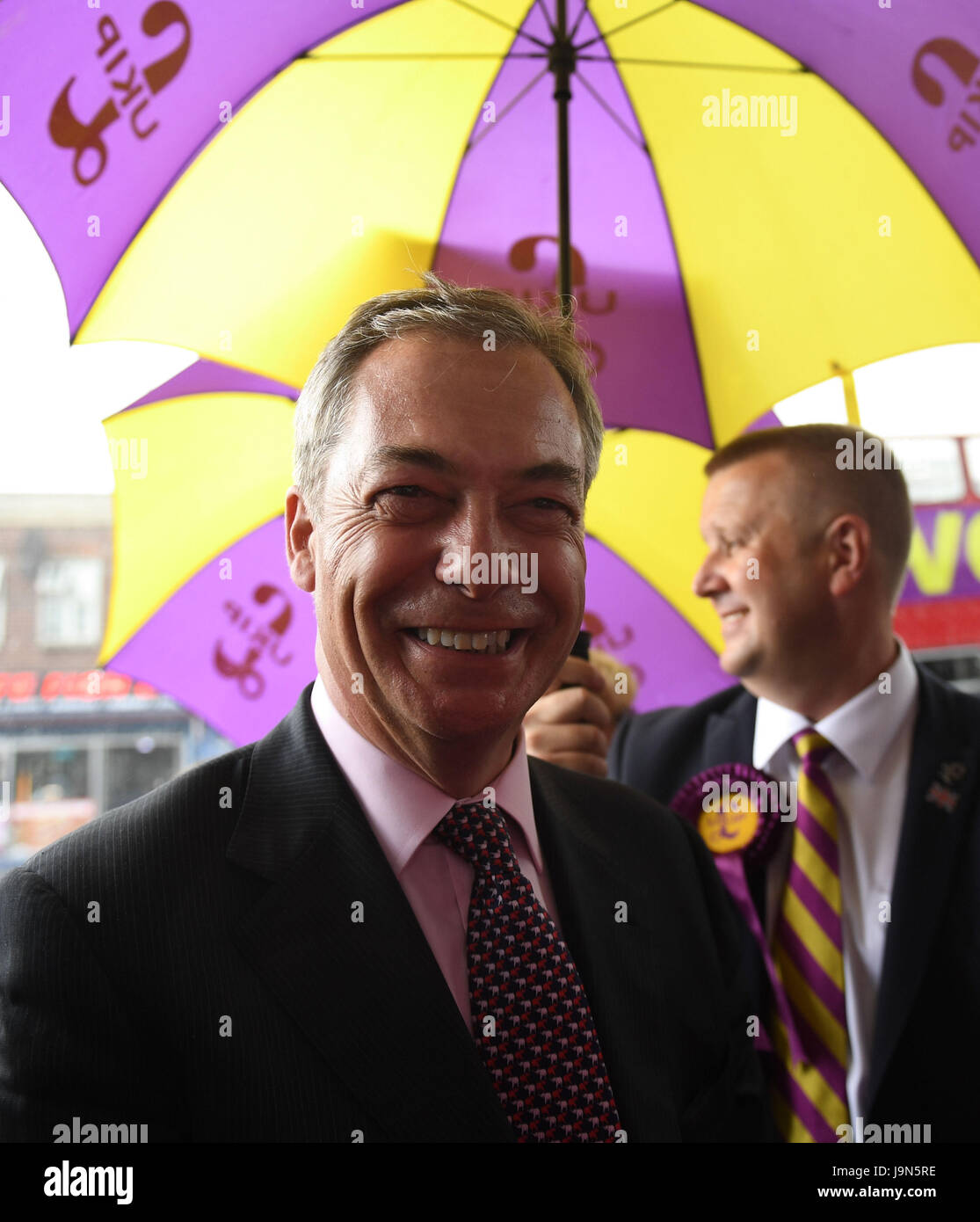 Former Ukip leader Nigel Farage with local candidate Peter Harris (back ...