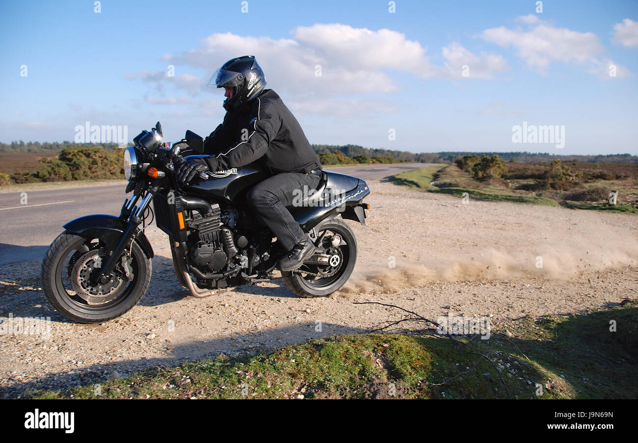 Triumph Speed Triple motorcycle spinning back wheel Stock Photo - Alamy