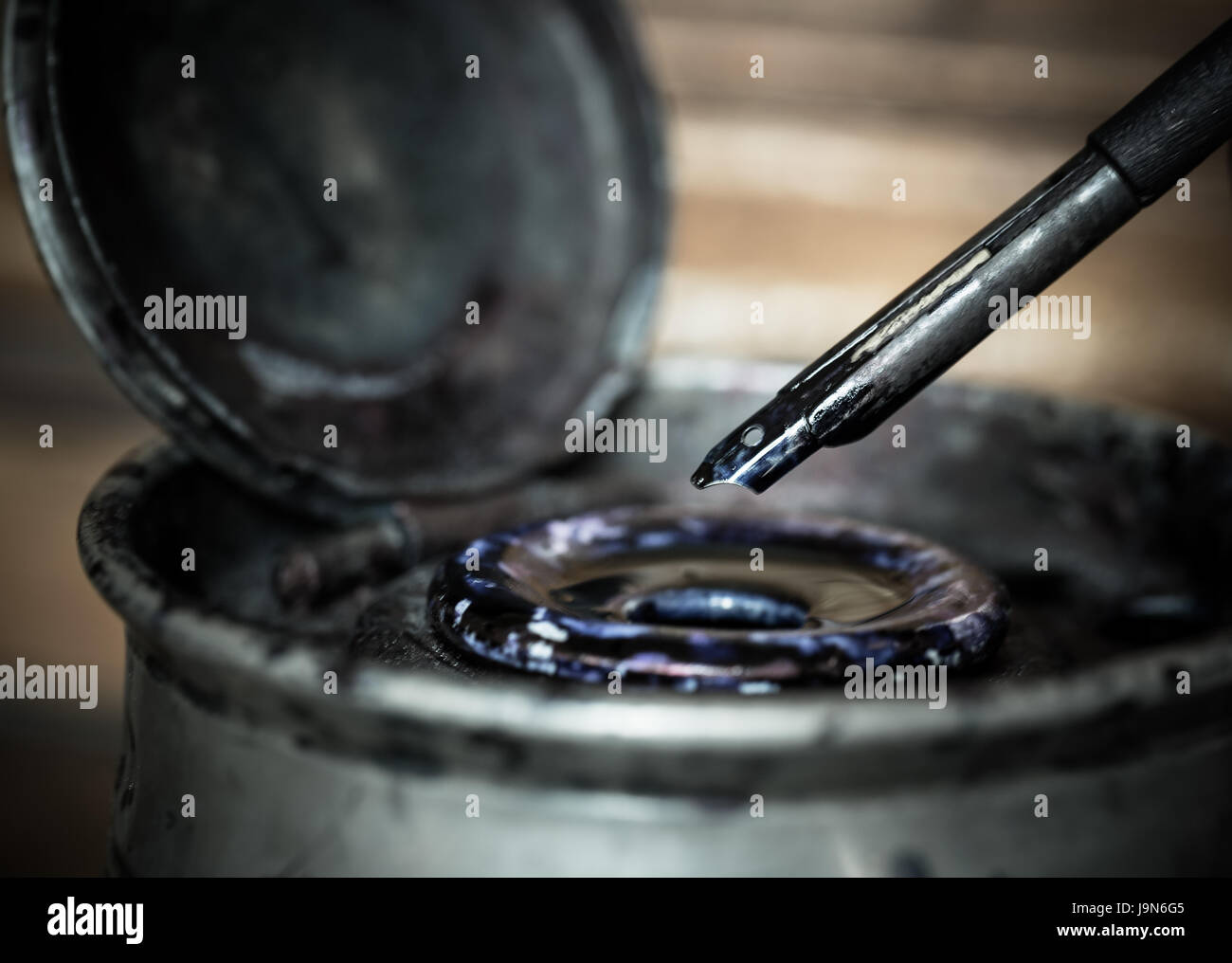 Pen being dipped in ink hi-res stock photography and images - Alamy