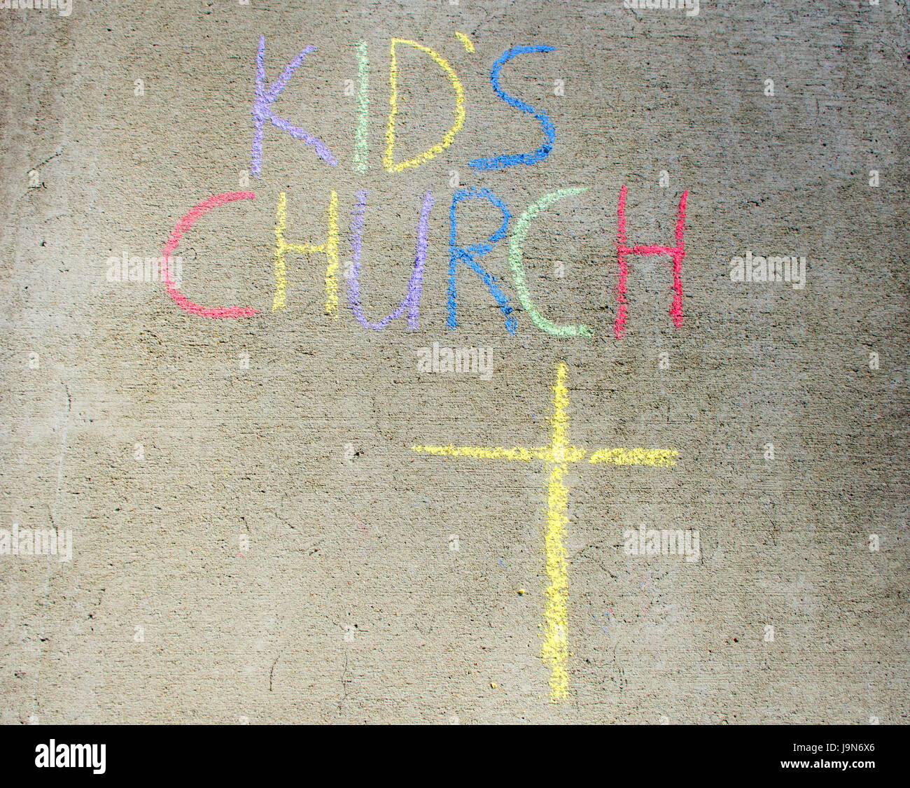 Kid's Church with cross written on sidewalk in colorful chalk Stock ...