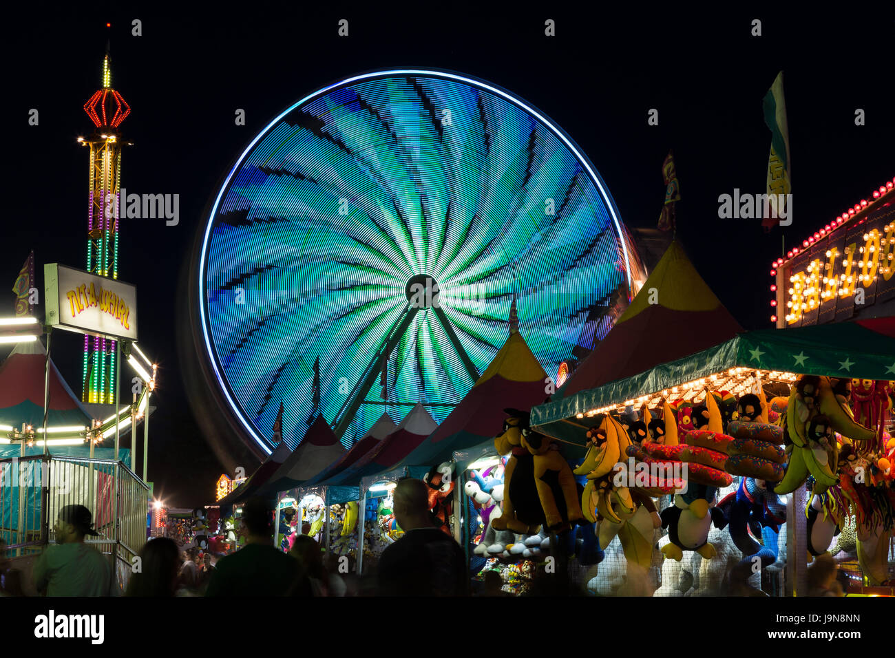 Spinning rides are colorful at the county fair Stock Photo - Alamy