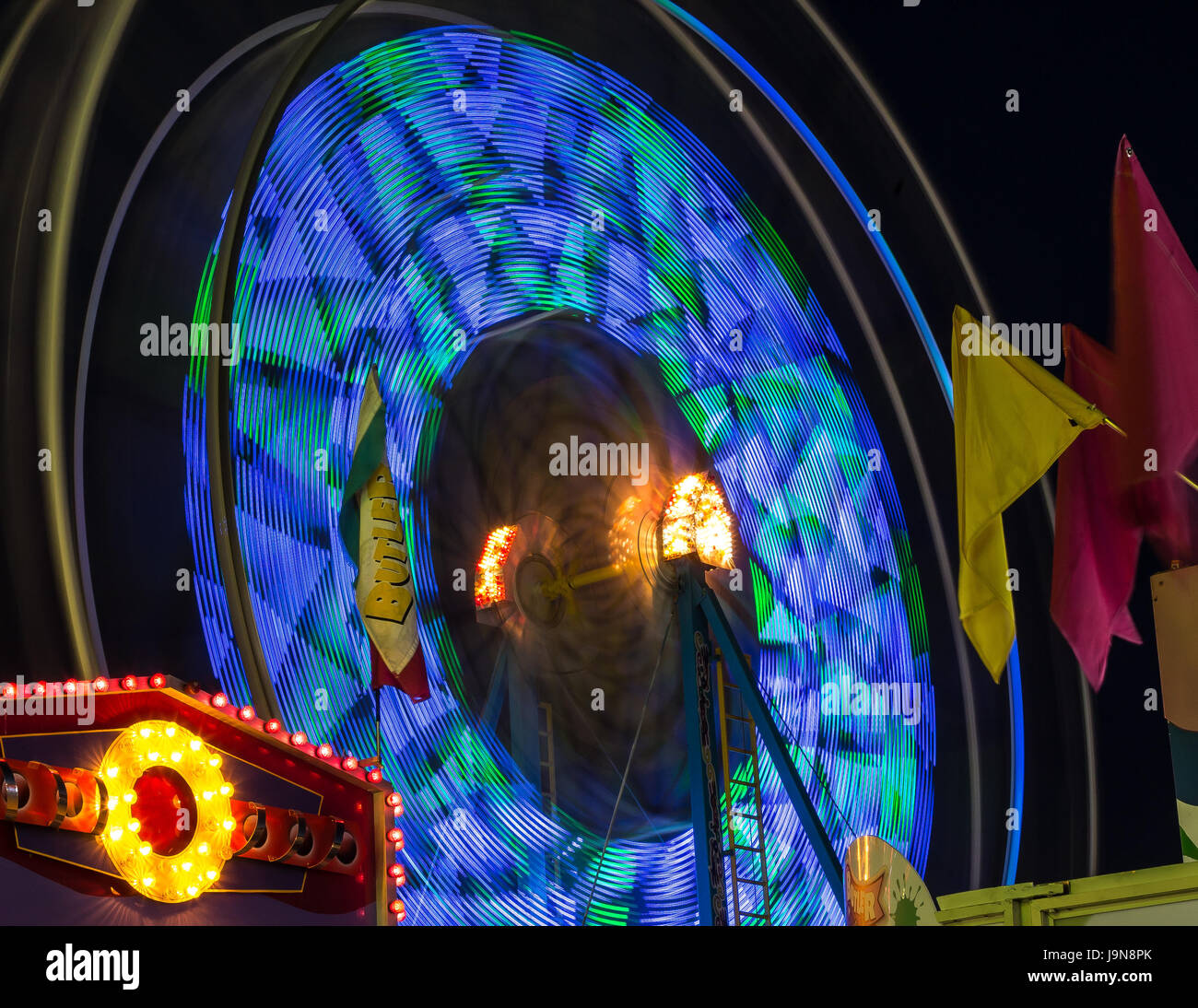 Spinning rides are colorful at the county fair Stock Photo - Alamy