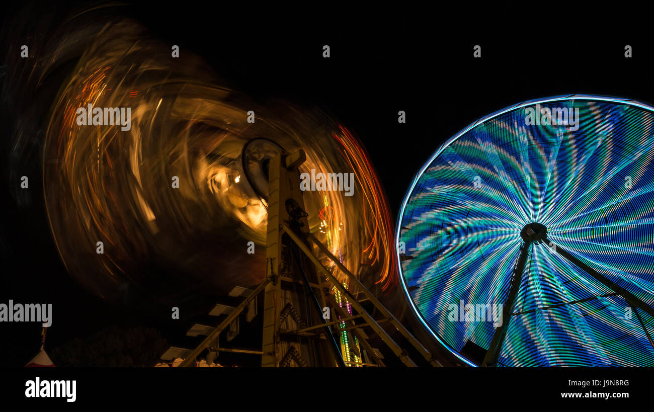 Spinning rides are colorful at the county fair Stock Photo - Alamy