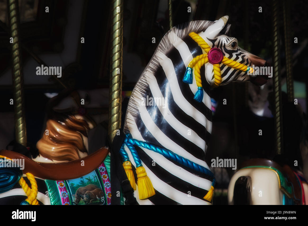 Merry go round animals at the county fair Stock Photo - Alamy