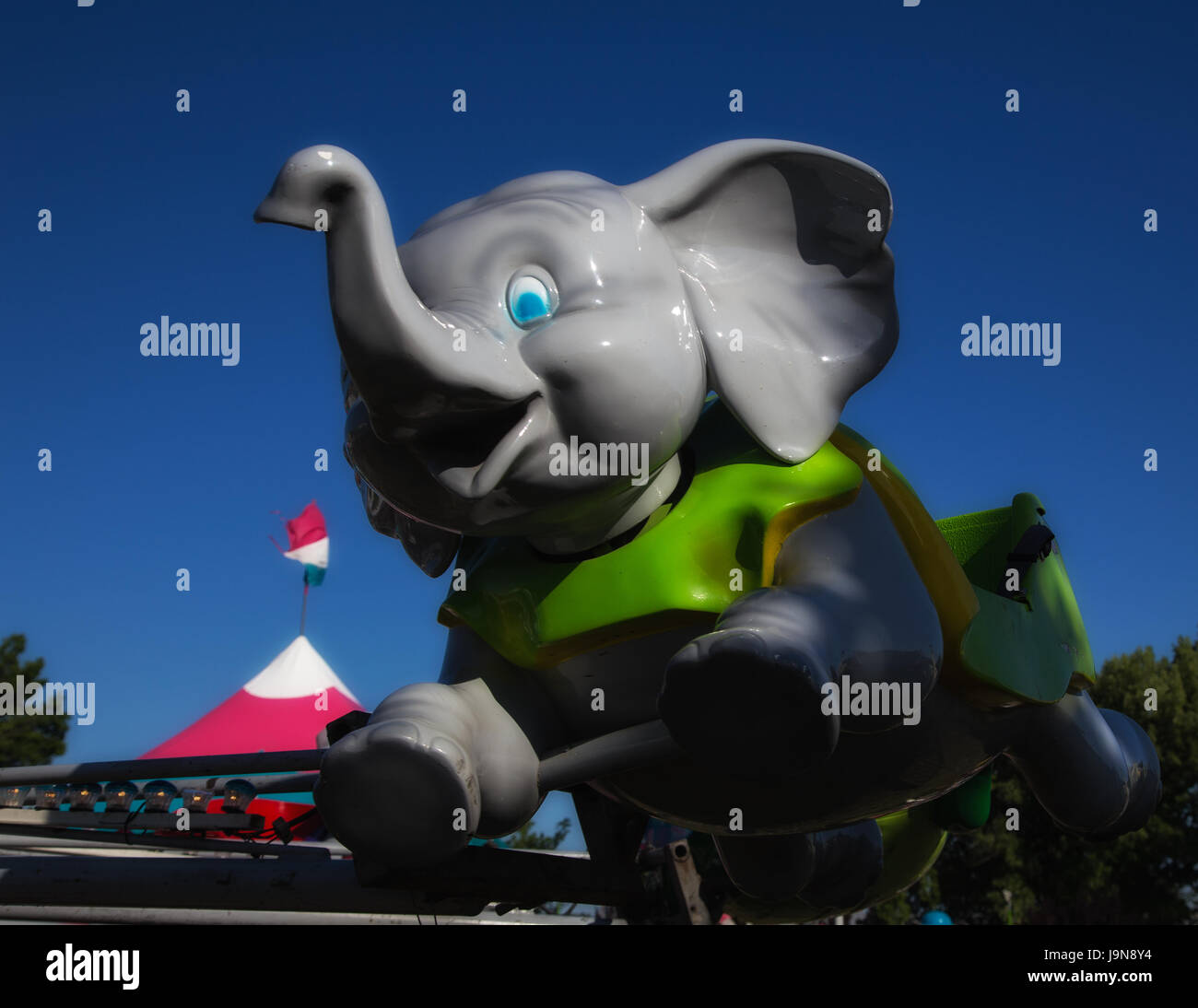 Flying elephant ride at the county fair Stock Photo - Alamy