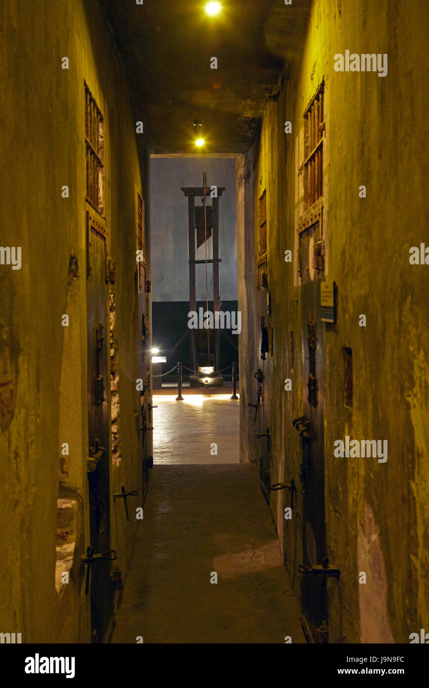 Cell block corridor and historic guillotine, Hoa Lo Prison Museum, (Aka ...