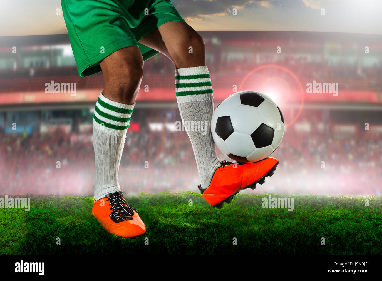 soccer football and player in sport stadium Stock Photo - Alamy