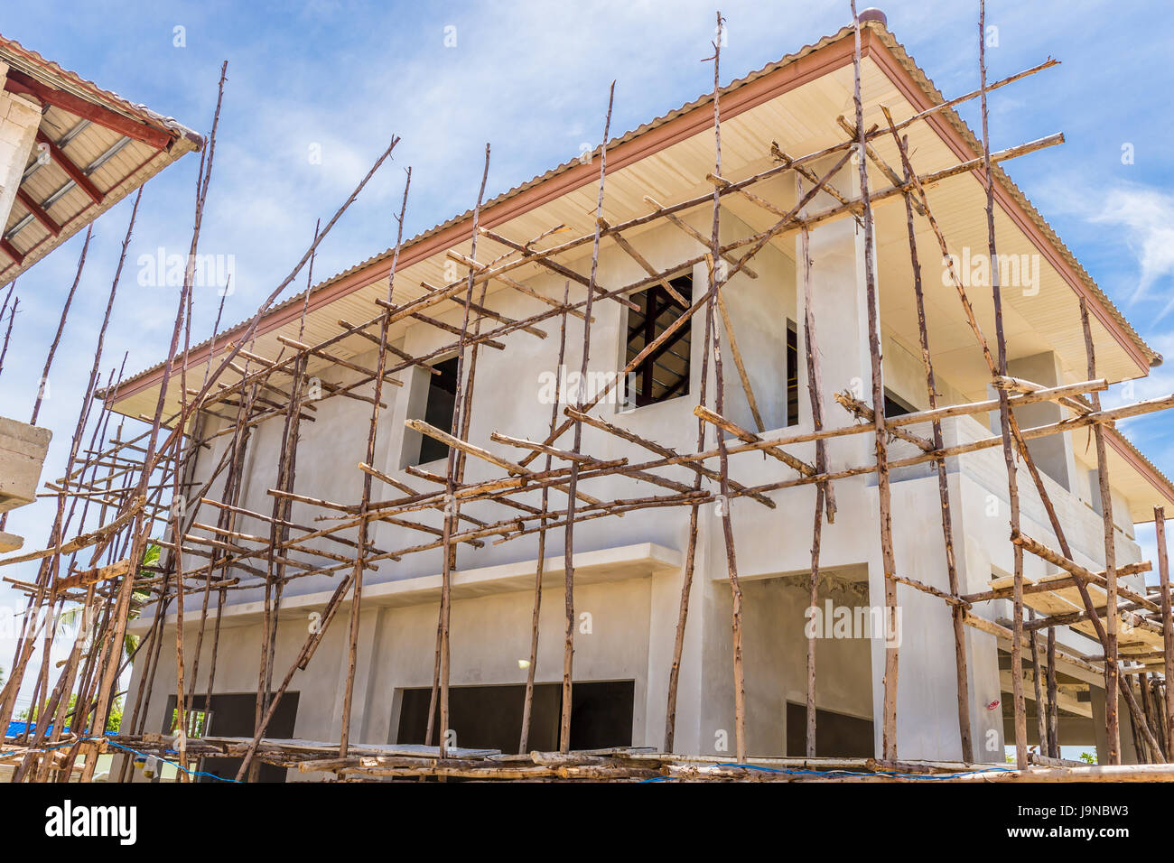 building a scaffold with bamboo for home Stock Photo - Alamy