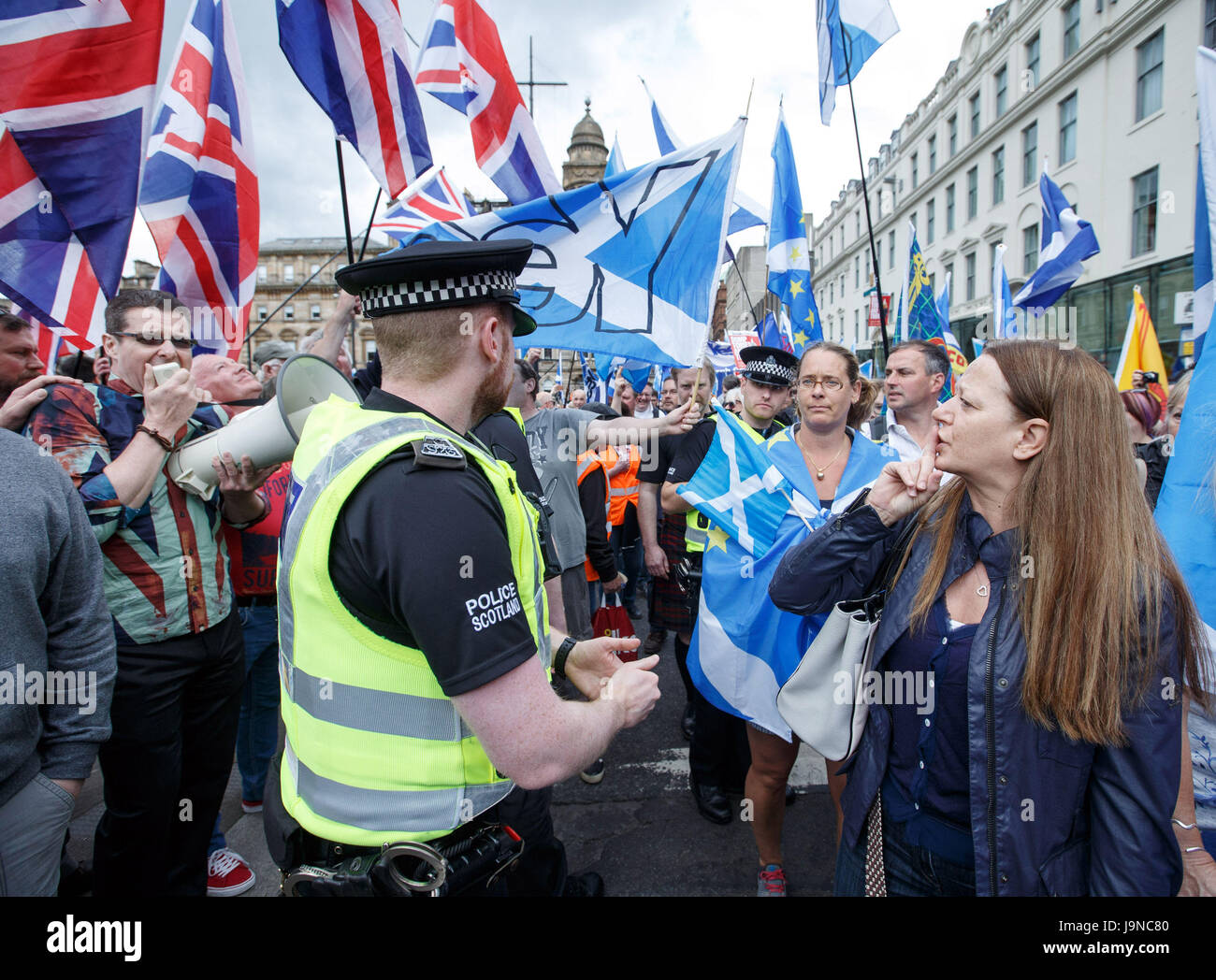 Police monitor the crowd as people taking part in the March for ...