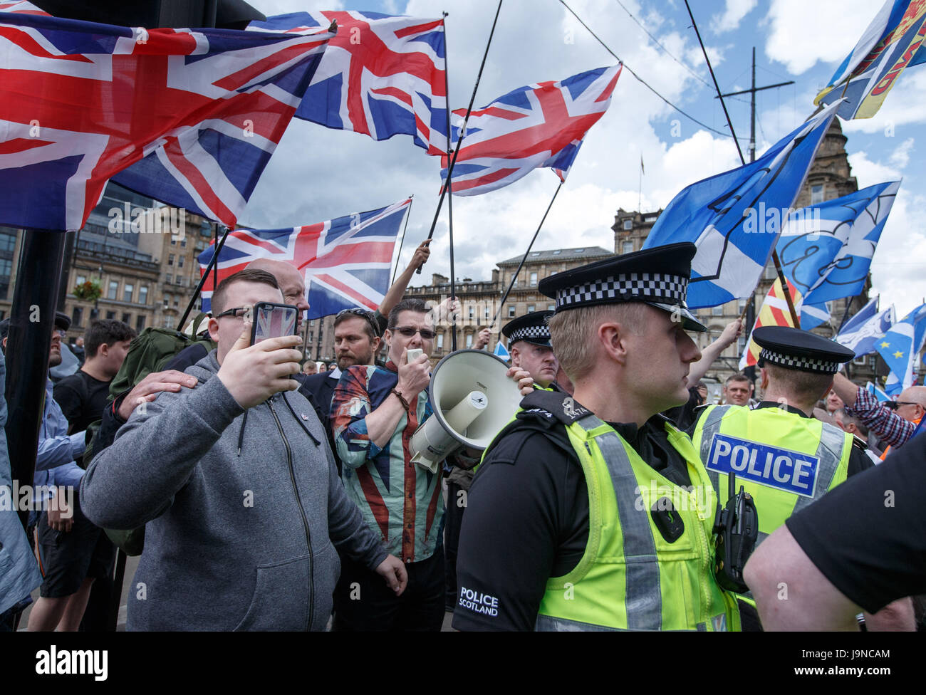 Police monitor the crowd as people taking part in the March for ...