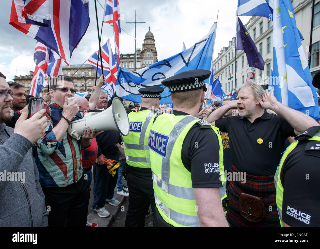 Police monitor the crowd as people taking part in the March for ...
