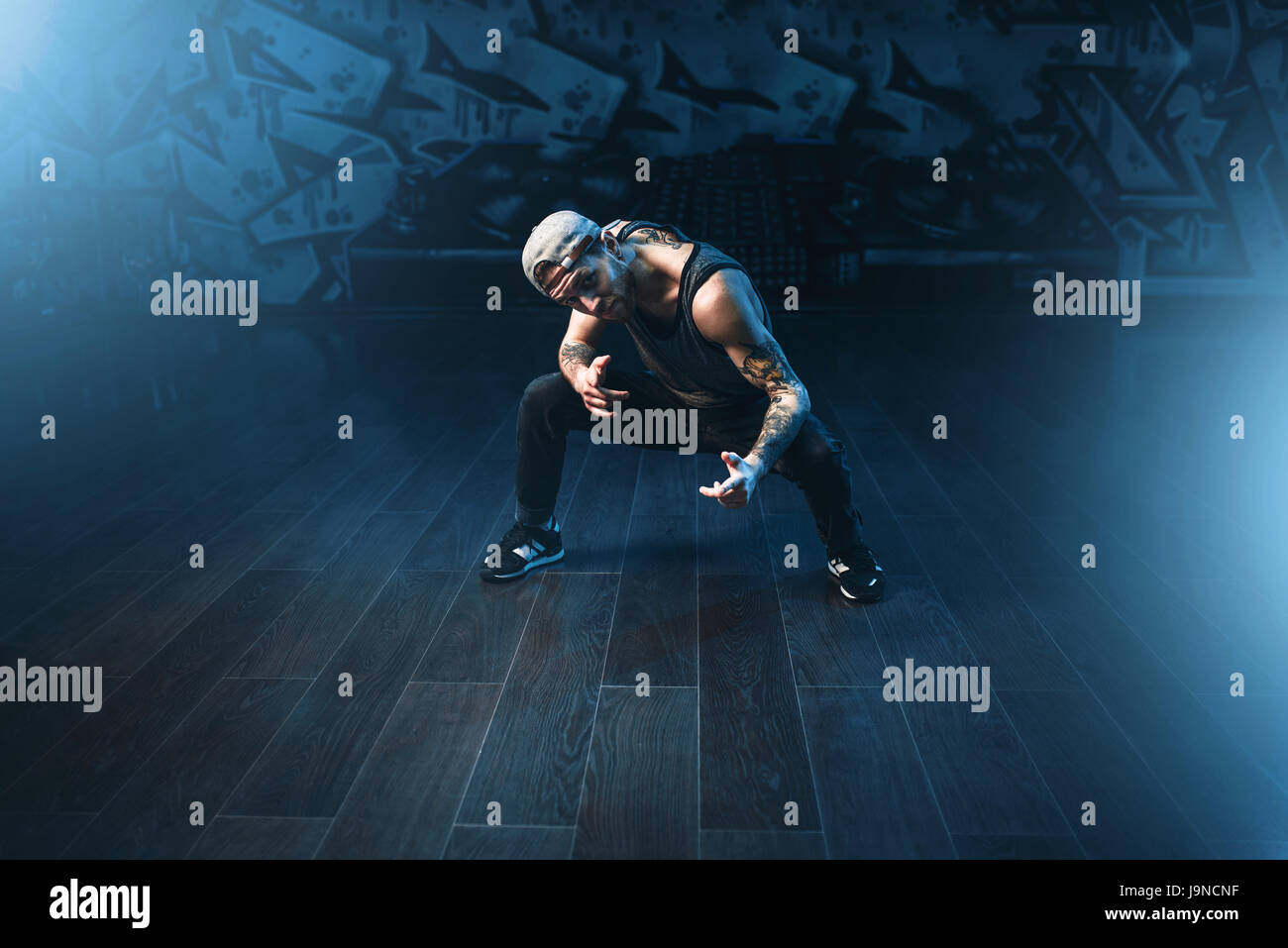 Male rapper in dance studio, trendy lifestyle. Modern urban dancing ...
