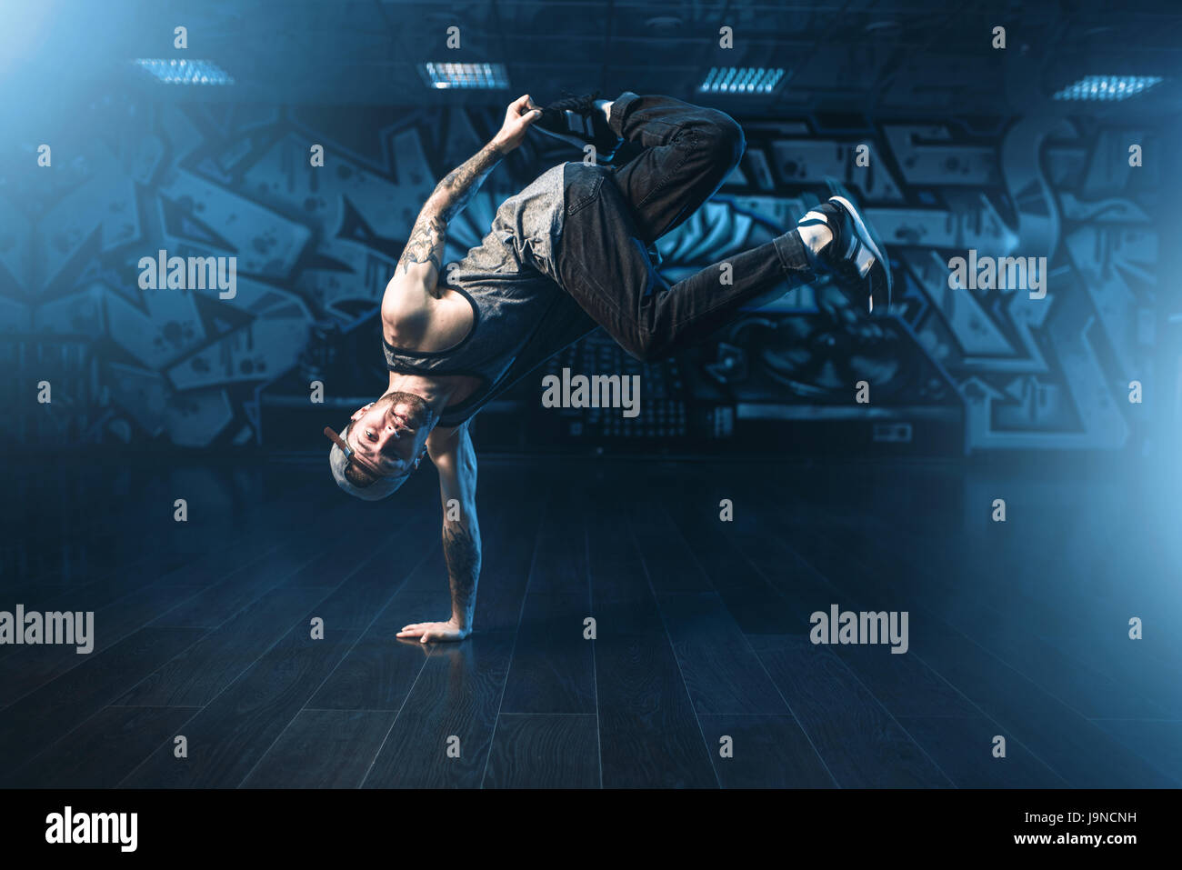 Male rapper in dance studio, trendy lifestyle. Modern urban dancing ...