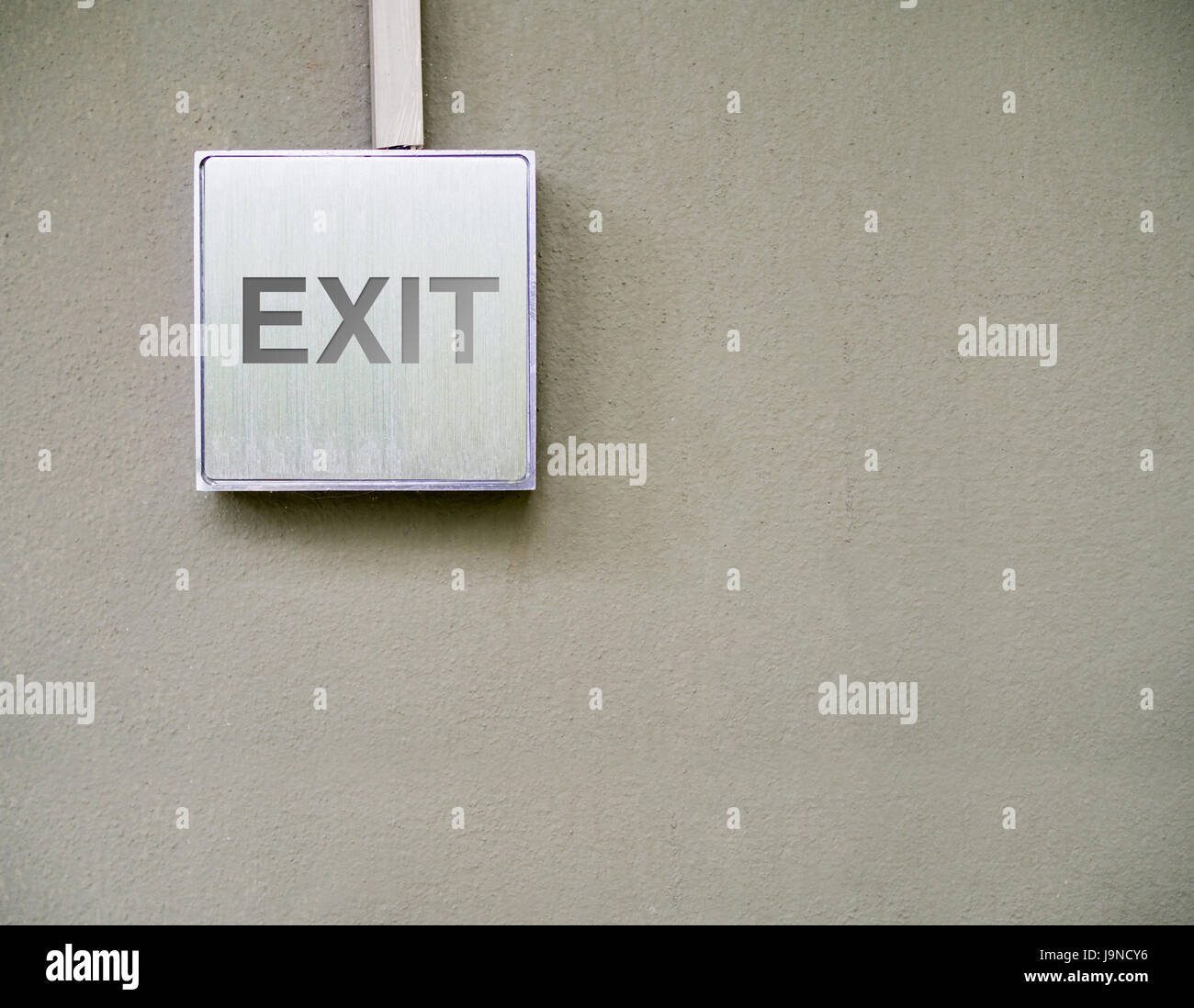 Exit on silver sign on concrete wall, modern building sign concept ...