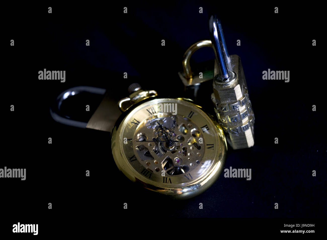 time and security with an old clock and some locks Stock Photo - Alamy