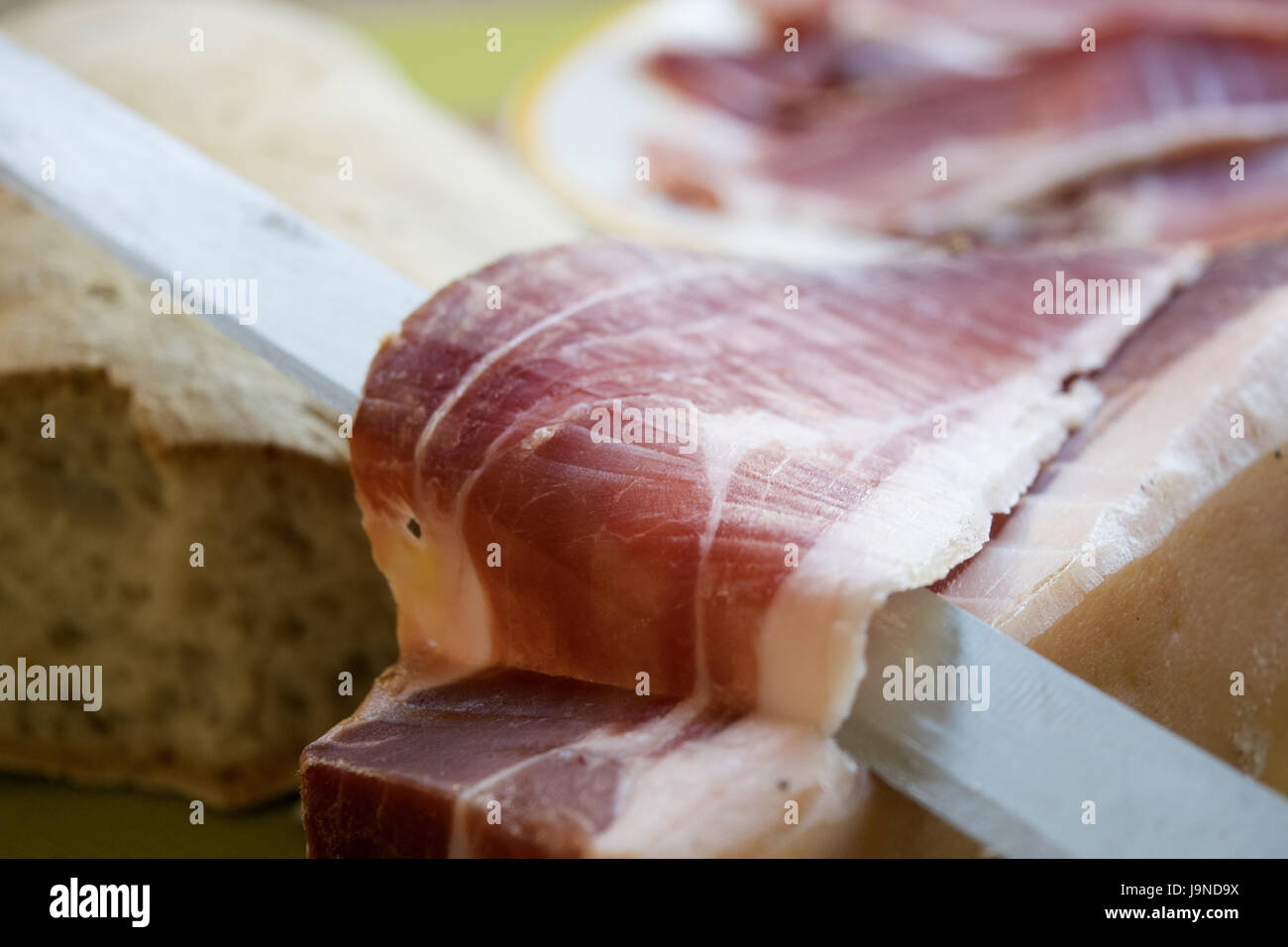 famous Italian dry-cured ham called prosciutto di parma cut by hand ...