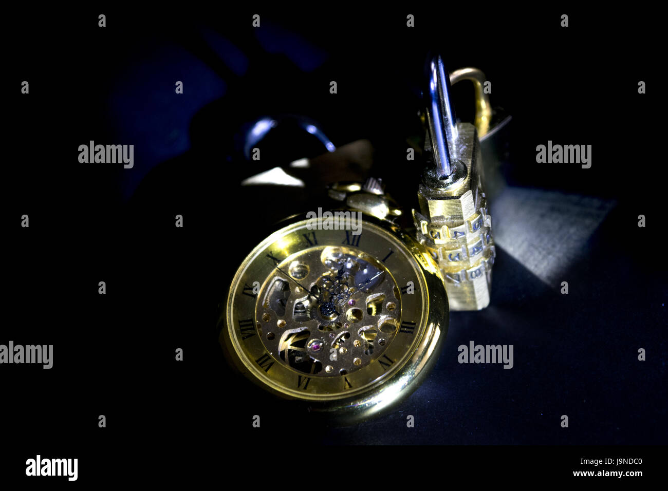 time and security with an old clock and a padlock Stock Photo - Alamy