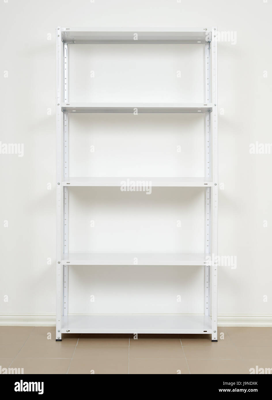 white metal rack near the wall, empty shelves Stock Photo - Alamy