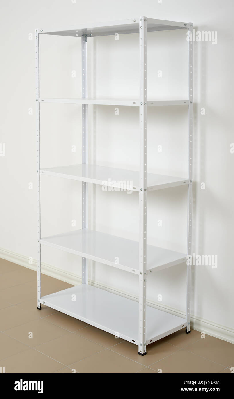 white metal rack near the wall, empty shelves Stock Photo - Alamy
