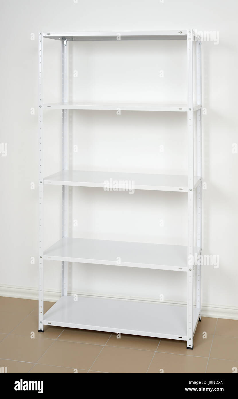 white metal rack near the wall, empty shelves Stock Photo - Alamy