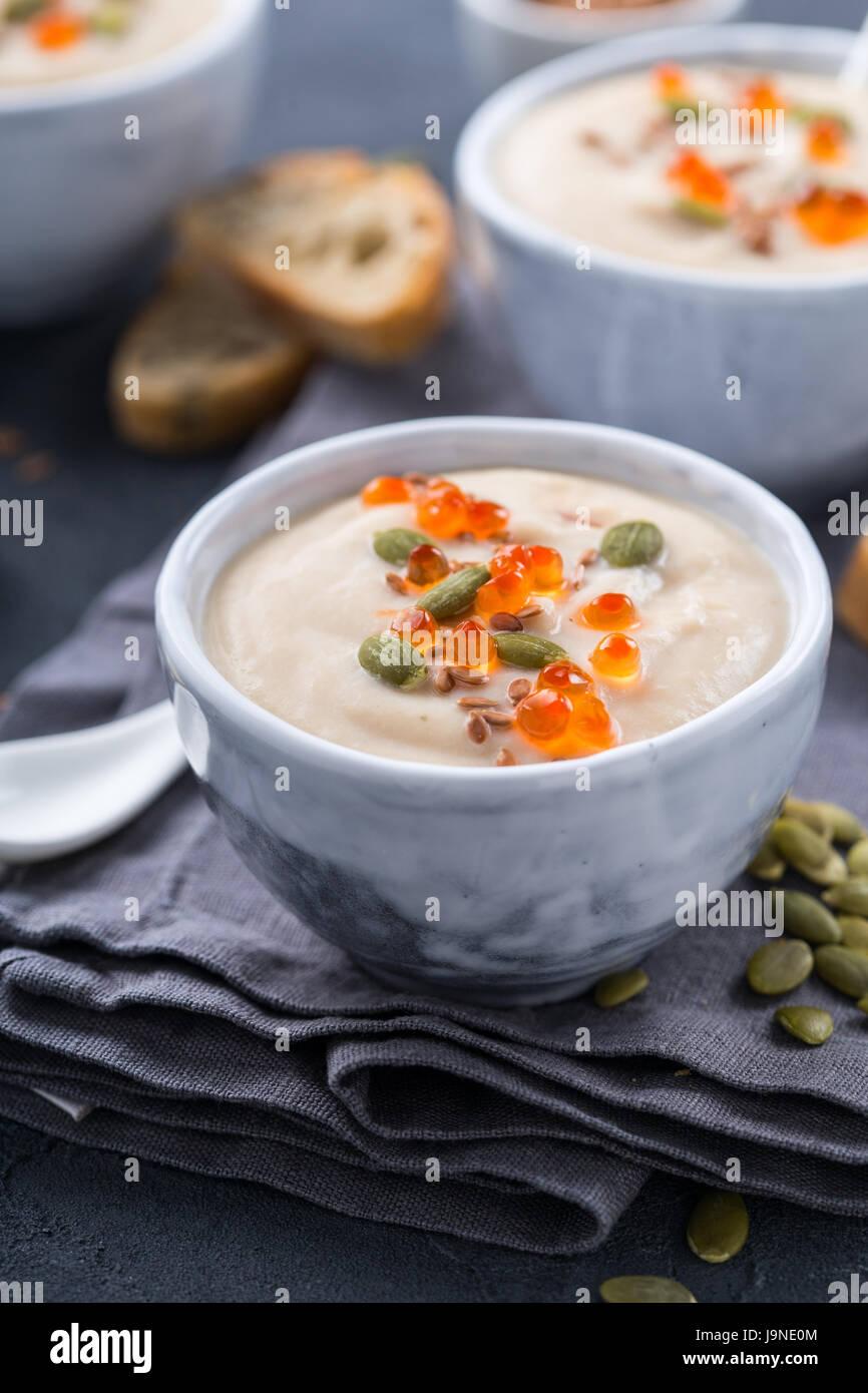 Close up of a gourmet creamy soup with red caviar Stock Photo - Alamy