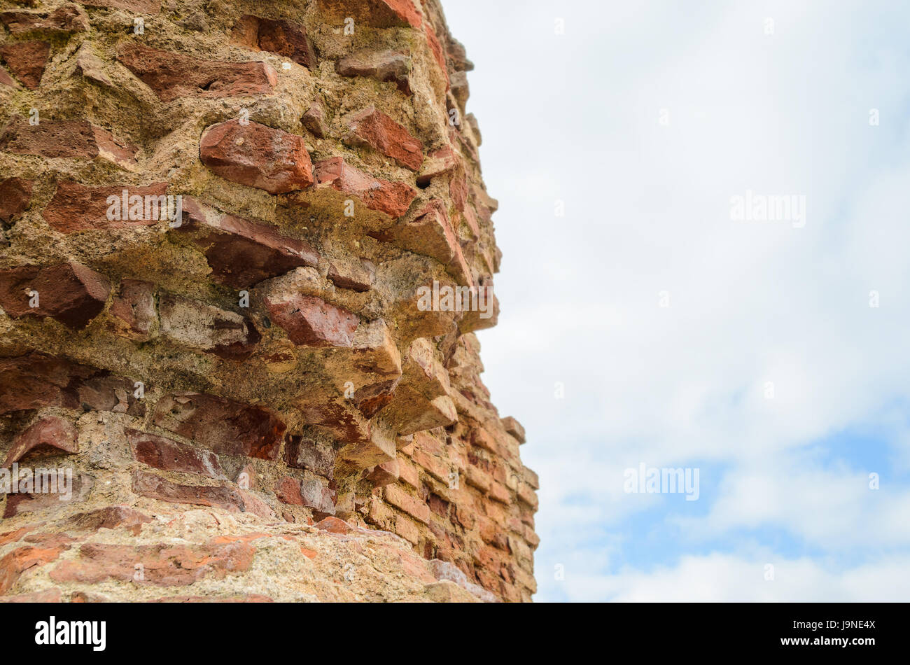 Ancient ruins of the destroyed and broken brick wall of fortress ...