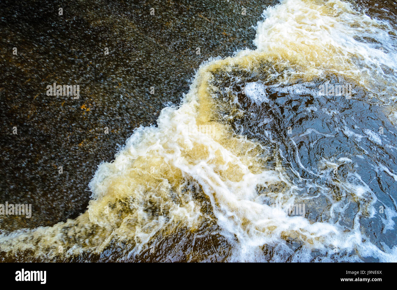 River in motion nature background. Foaming water on the rapids of the ...