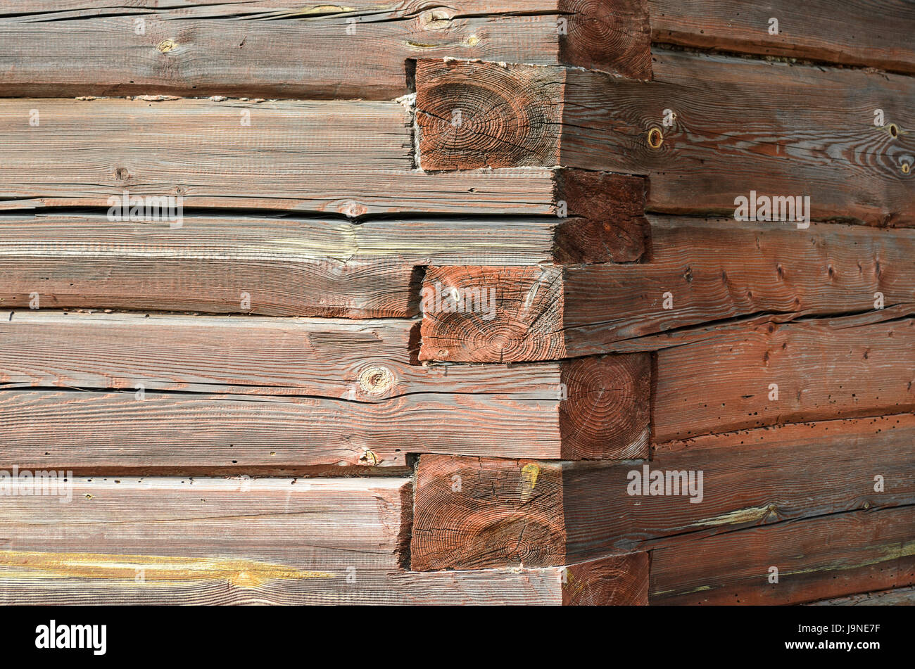 Log masonry. Corner of the log cabin made of logs. Old texture on old ...