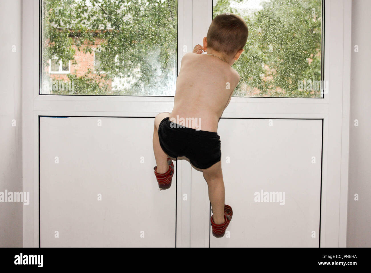 Child abduction. Photo for your design. Escape through the window Stock ...