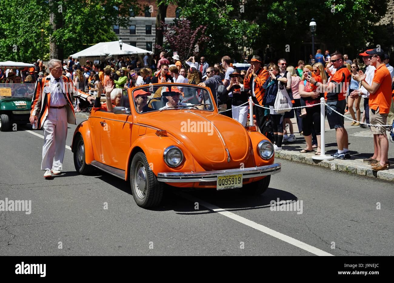 Princeton University alumni dressed in orange and black march joyously ...