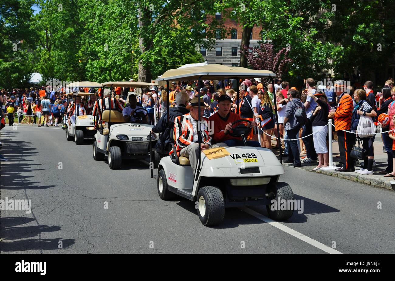 Princeton University alumni dressed in orange and black march joyously ...