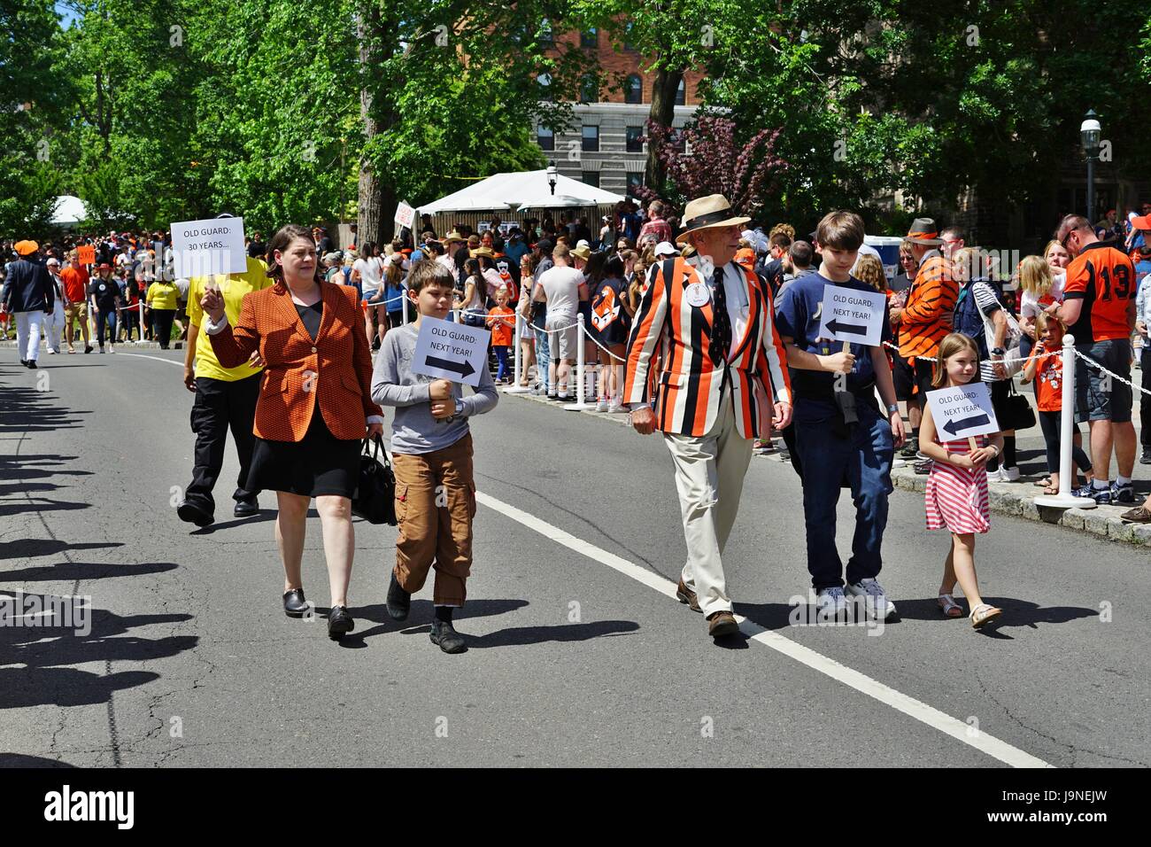 Princeton University alumni dressed in orange and black march joyously ...