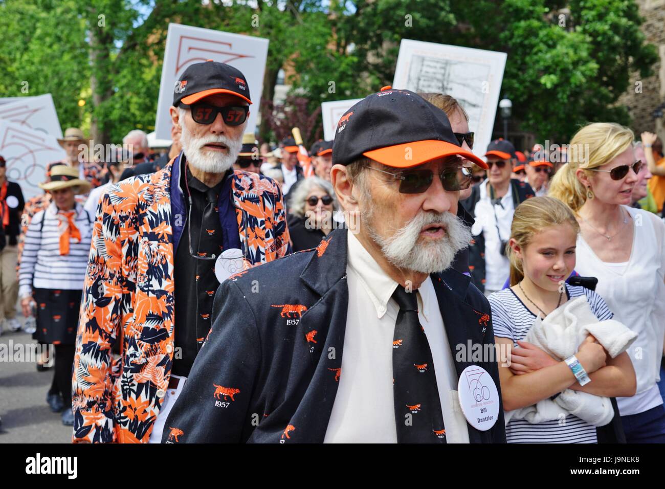 Princeton University alumni dressed in orange and black march joyously ...