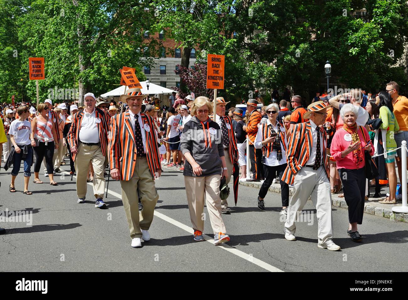 Princeton University alumni dressed in orange and black march joyously ...