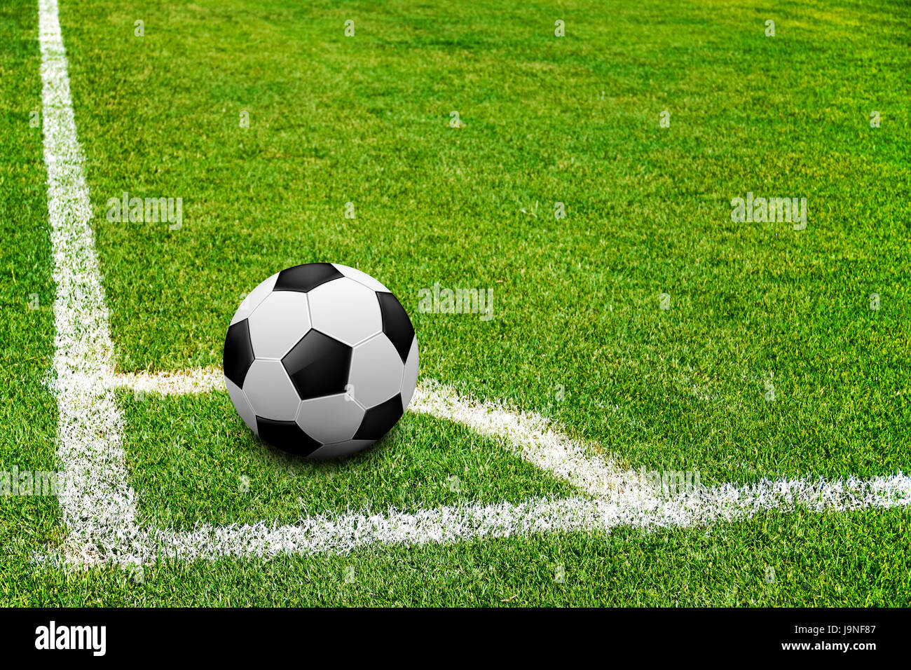 soccer ball on corner field Stock Photo - Alamy