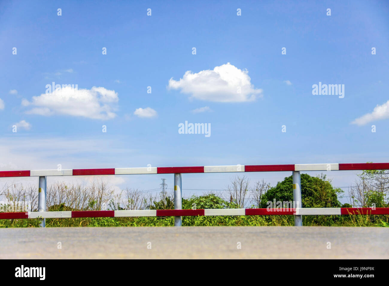 dangerous traffic fence beside street with blue sky for safety Stock ...
