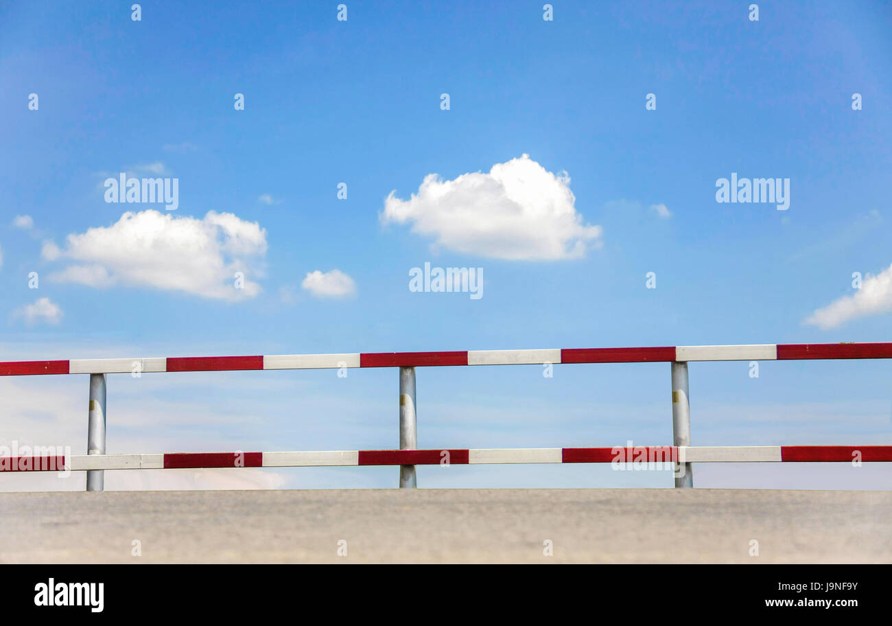 dangerous traffic fence beside street with blue sky for safety Stock ...