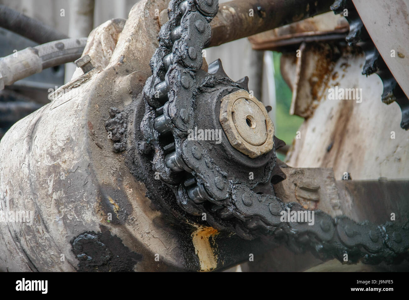 old chain with grease on propel roller for motor powered Stock Photo ...