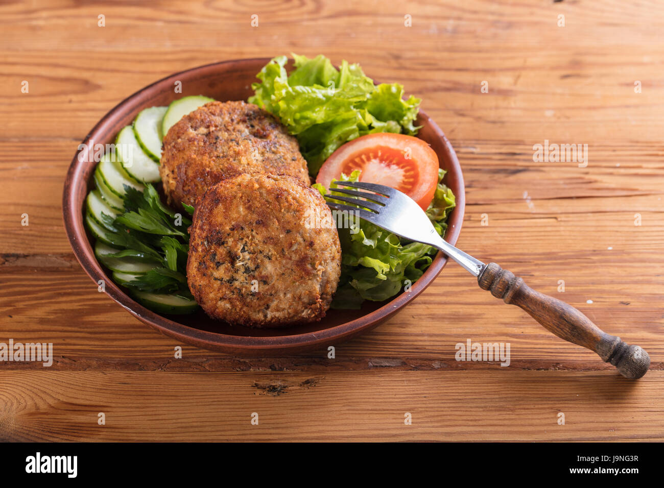 scotch egg with vegetables on a wooden background Stock Photo - Alamy