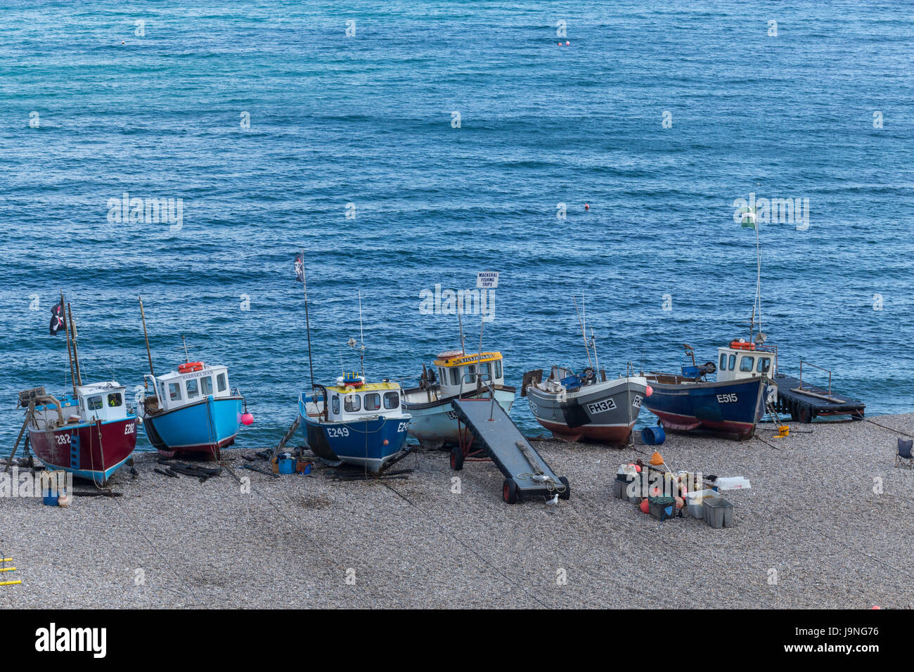 Fishing boats on the beach at Beer, Devon, a pretty fishing village on ...