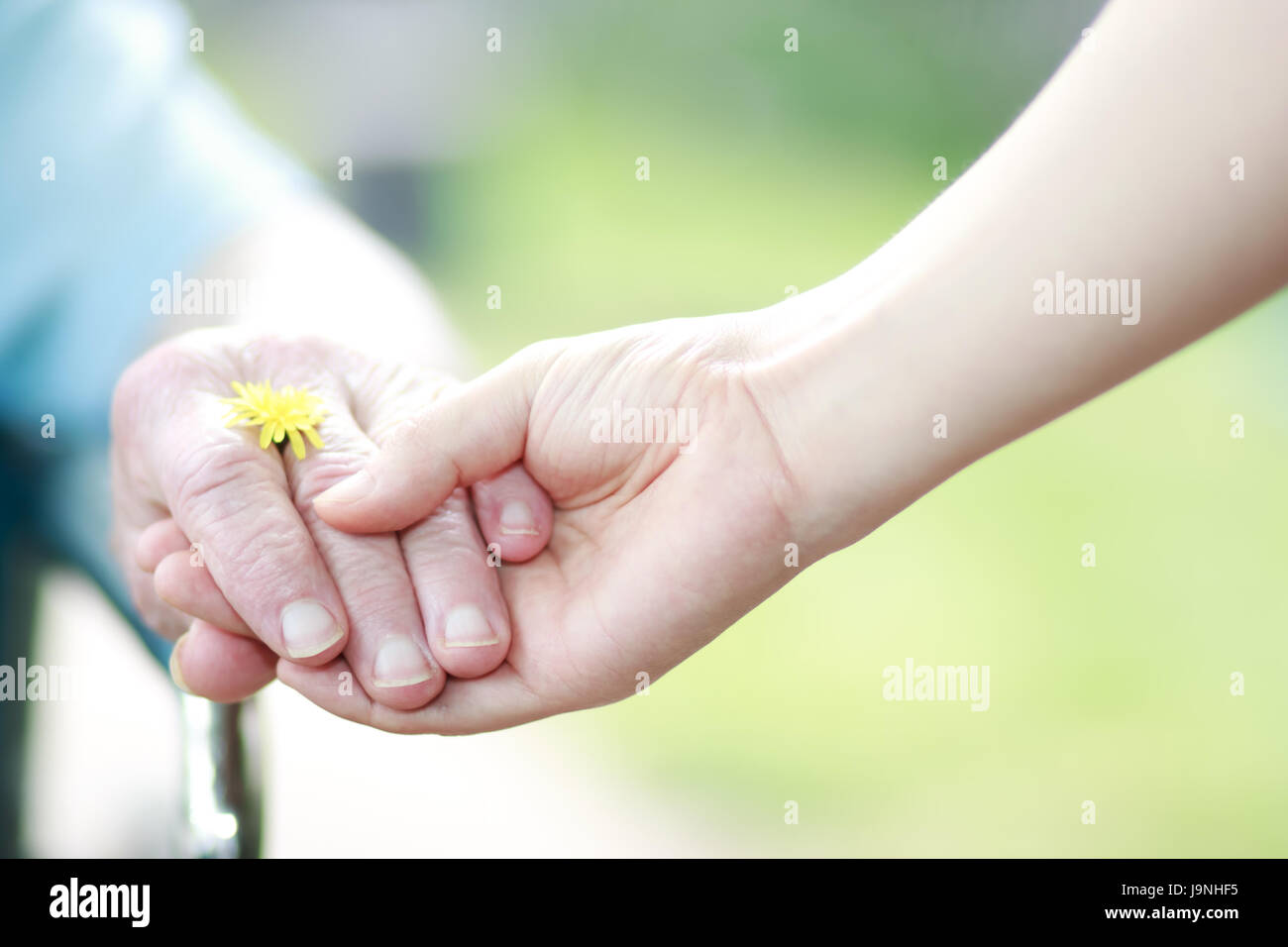 Helping hand senior street hi-res stock photography and images - Alamy