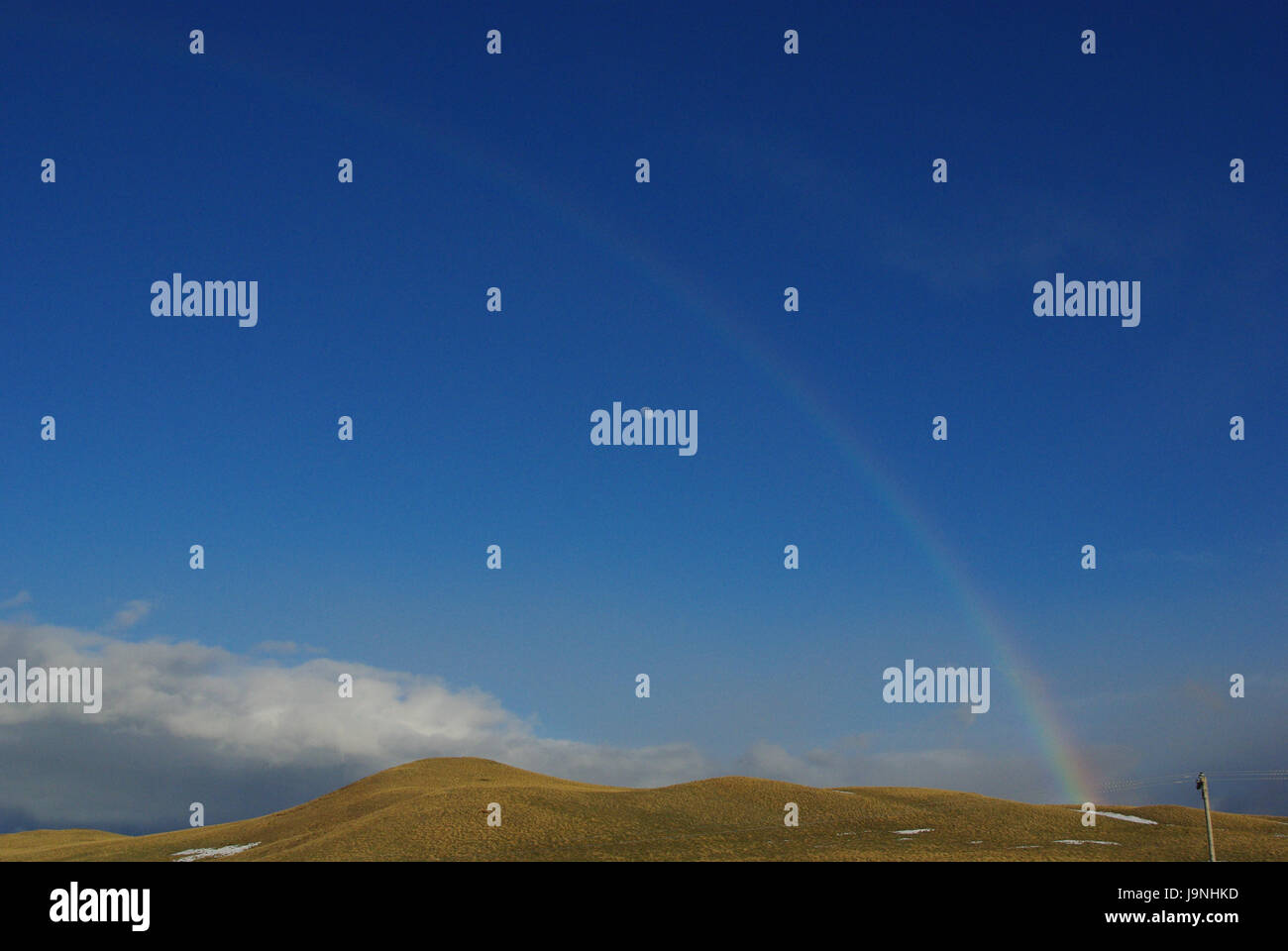 blue sky,rainbow and moon,montana highlands Stock Photo - Alamy