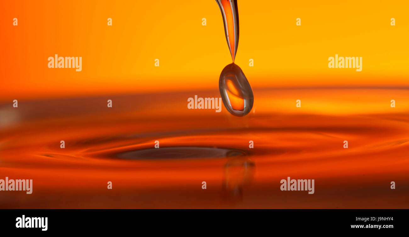 drop of ink falling into liqiud, abstract background Stock Photo - Alamy