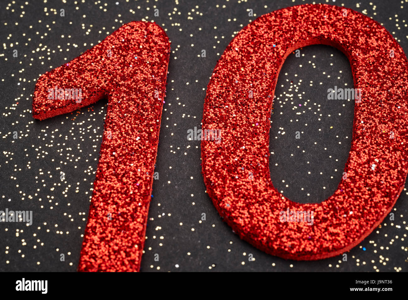 Number ten red color over a black background. Anniversary. Horizontal ...