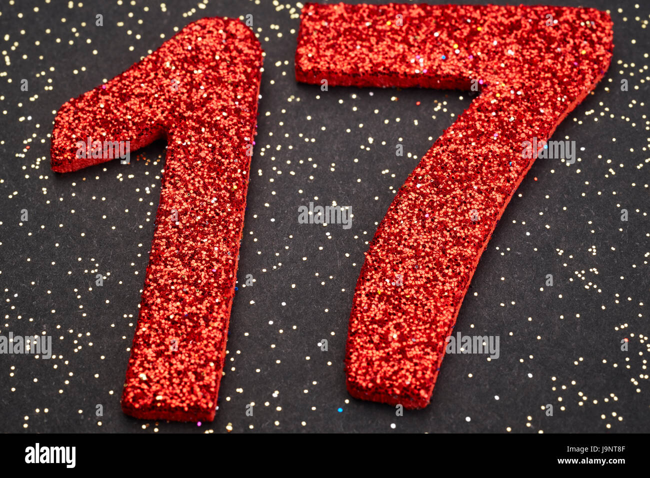 Number seventeen red color over a black background. Anniversary ...