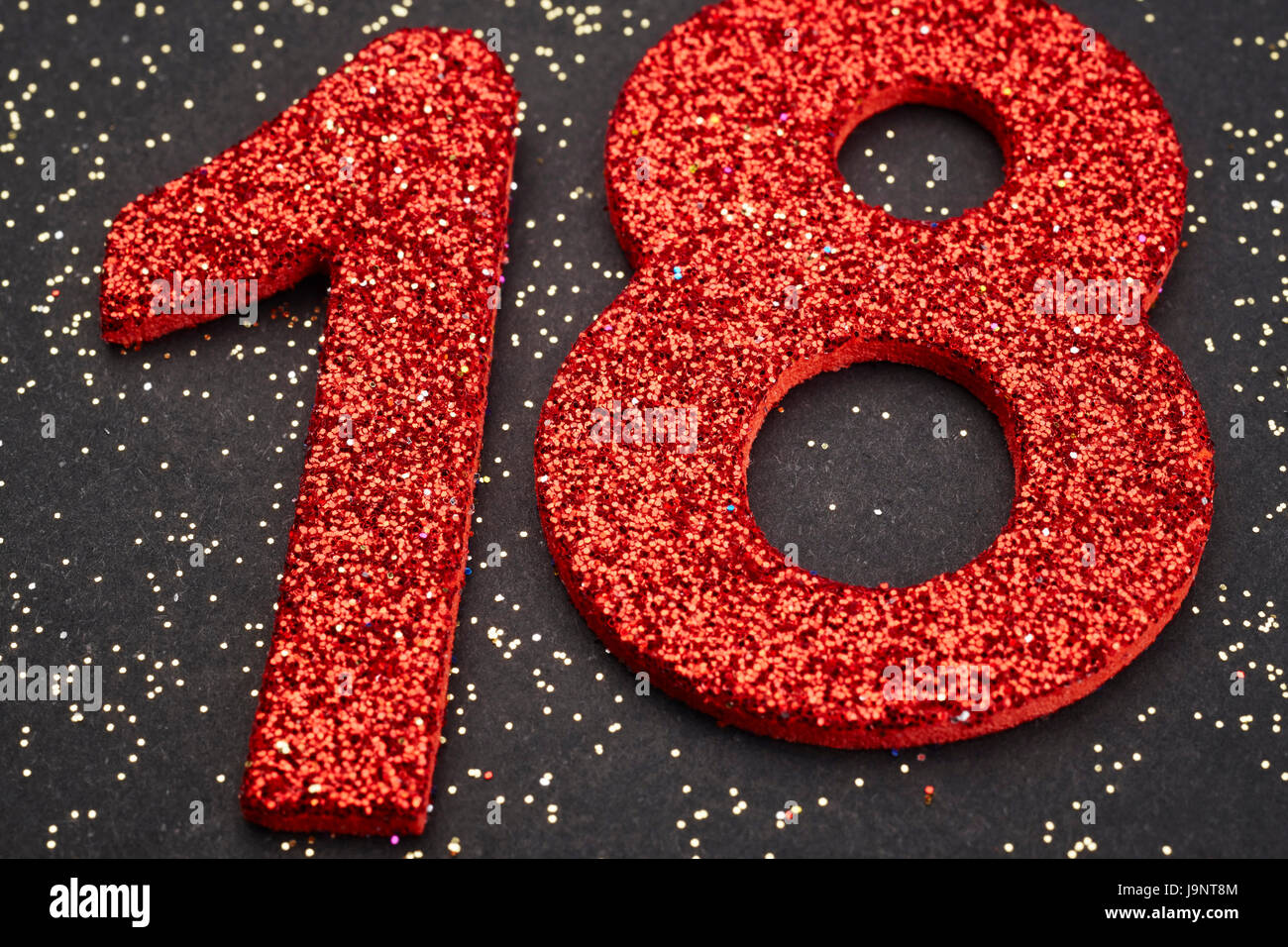Number eighteen red color over a black background. Anniversary ...