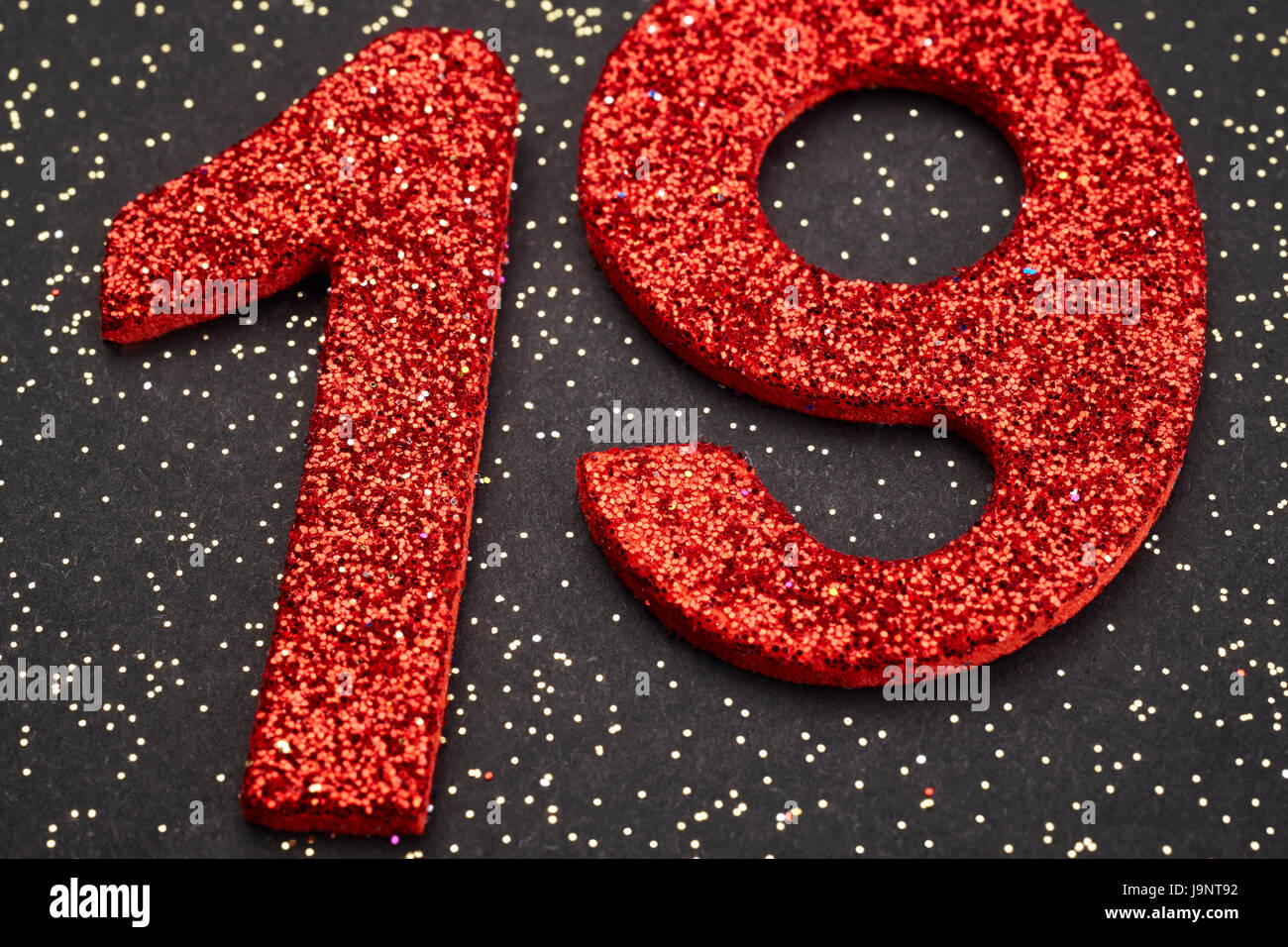Number nineteen red color over a black background. Anniversary ...