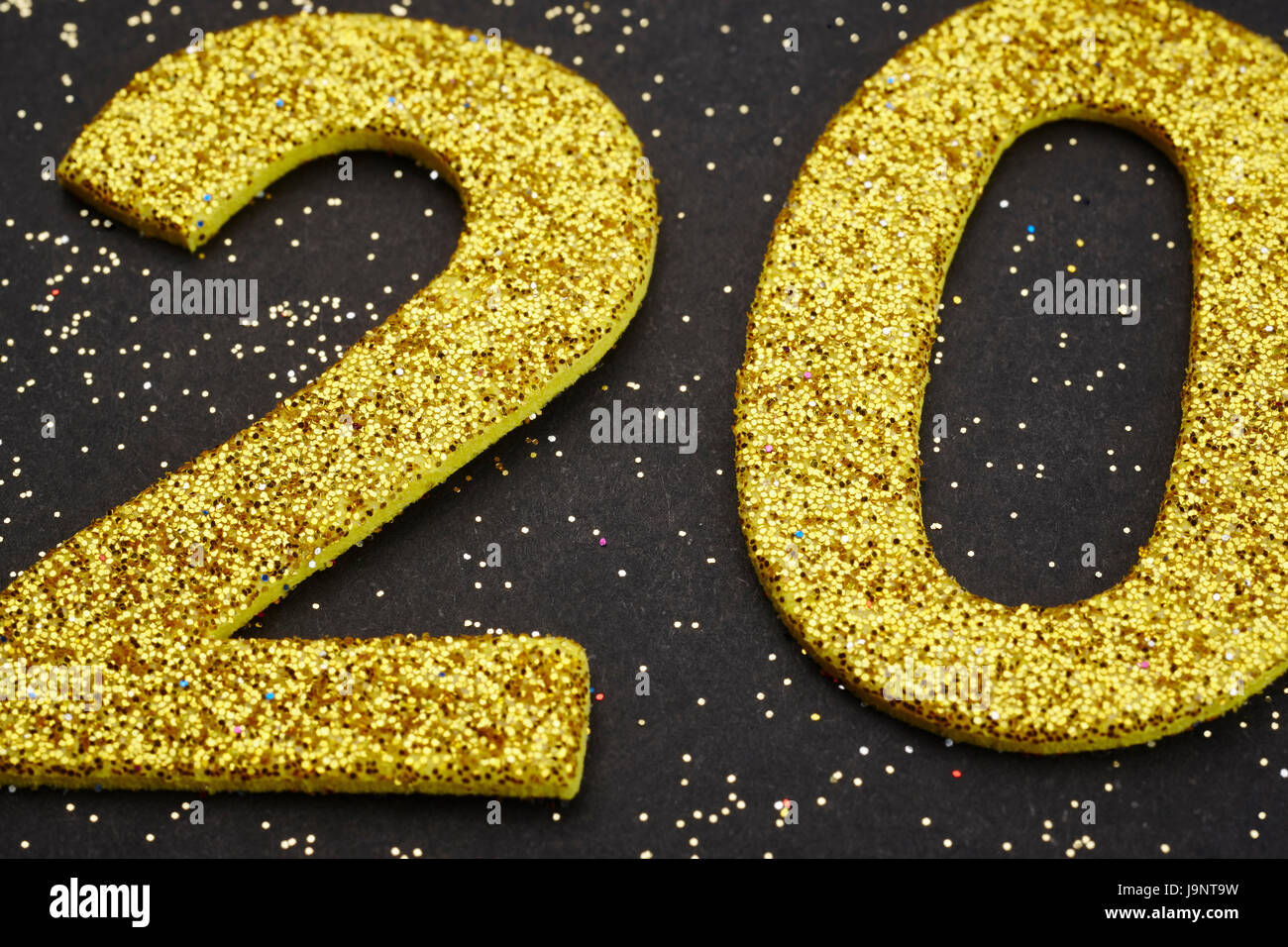 Number twenty yellow color over a black background. Anniversary ...