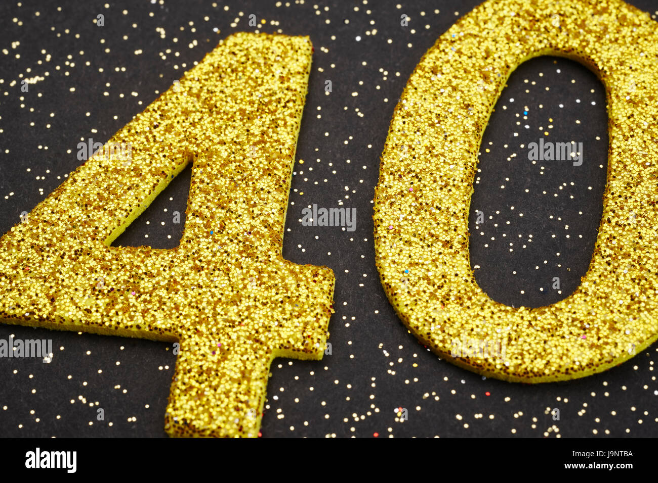 Number forty yellow color over a black background. Anniversary ...